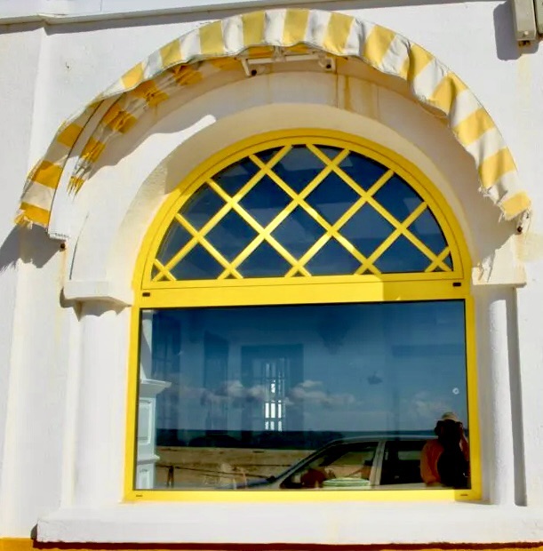 Lovely Yellow Windows in a Corner Shop – Wandering Teresa